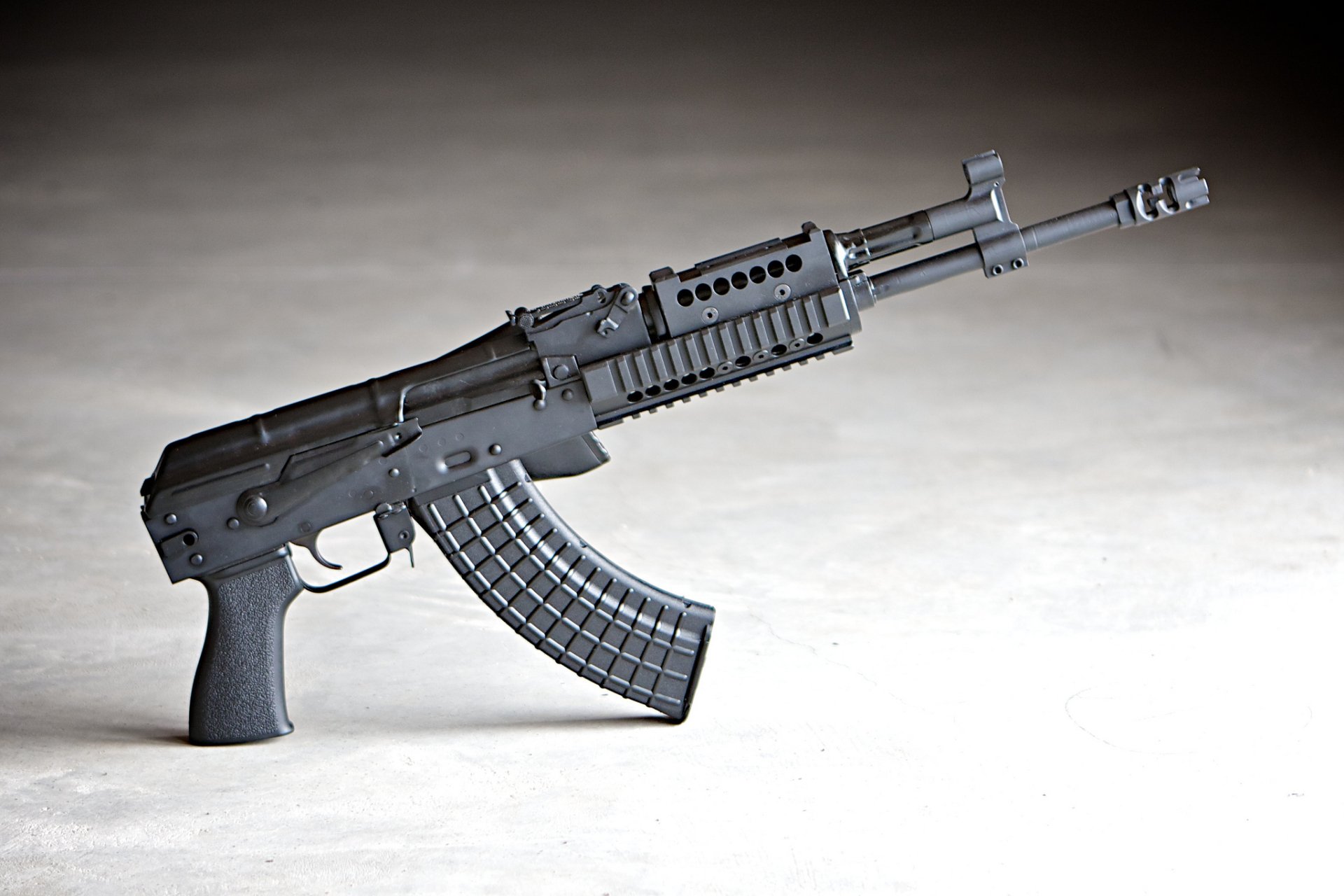 HD Precision: The Iconic Man-Made AK-47 Wallpaper