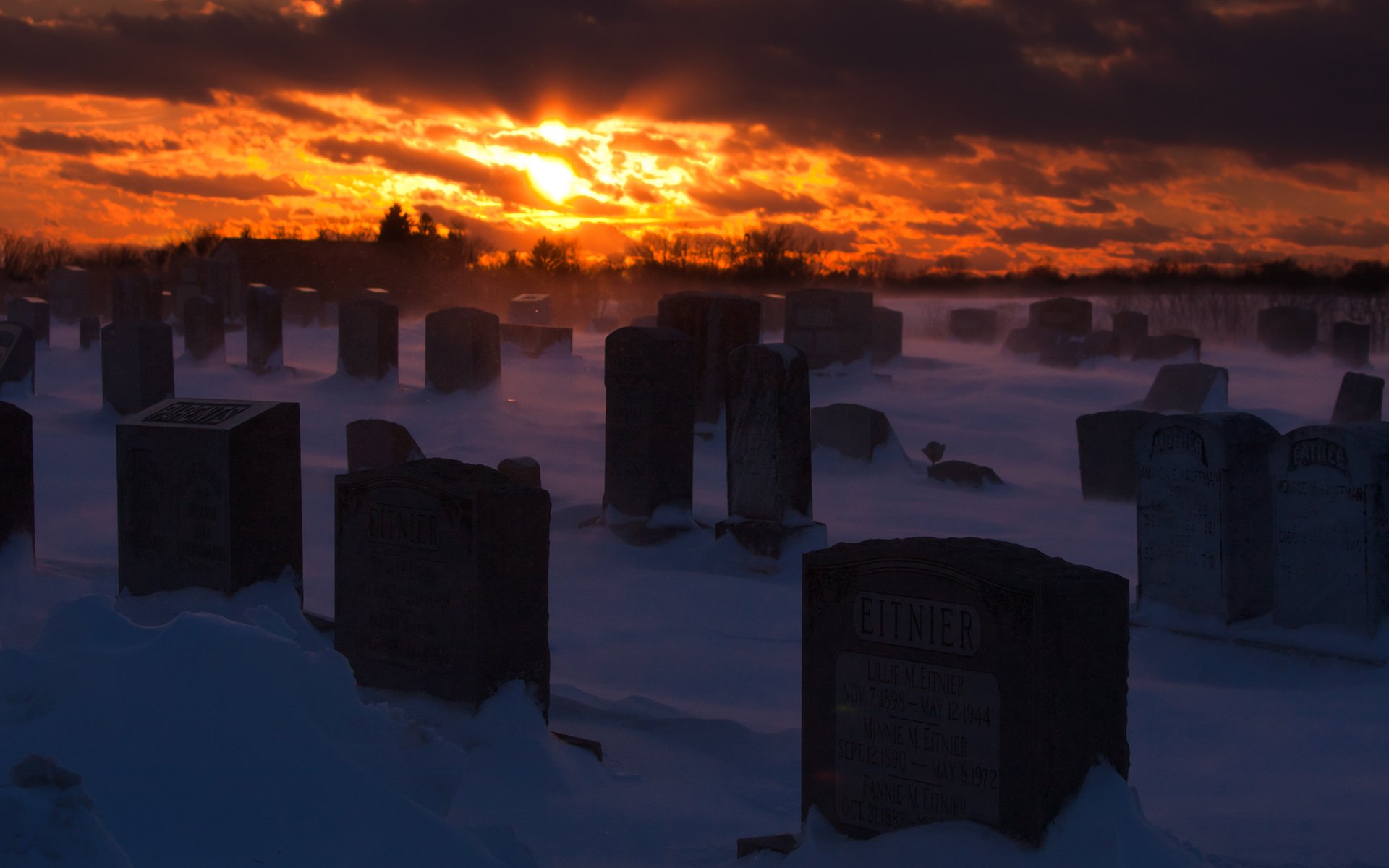 Sacred Sunset: HD Cemetery Tombstones in a Mystical Glow